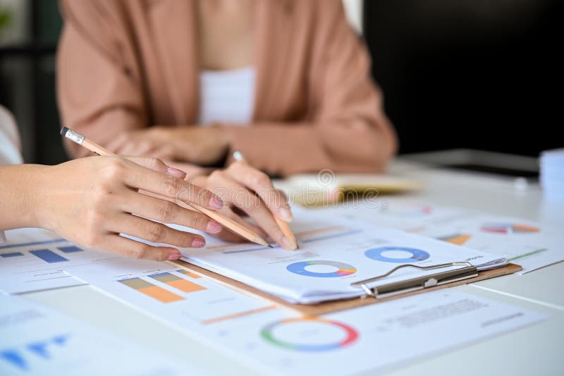 A Team of Professional Business and Financial Analysts Analyzing a ... A Team of Professional Business and Financial Analysts Analyzing a ...