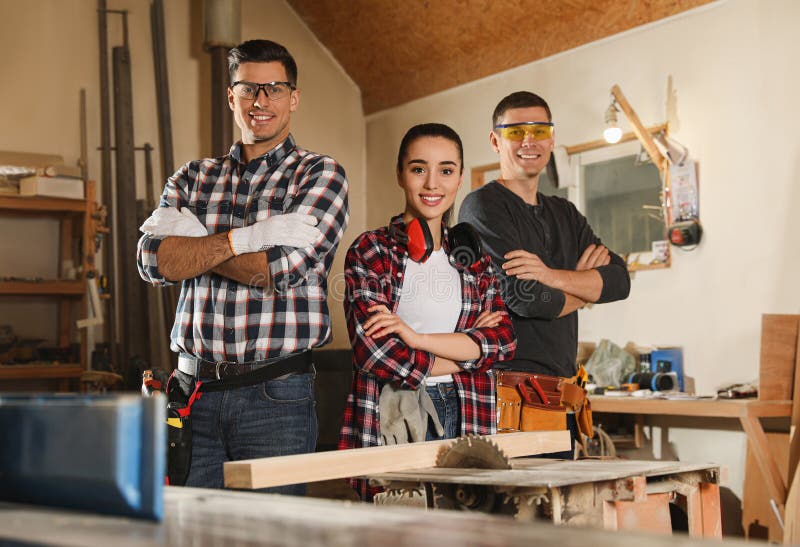 Team of Carpenters Workshop Workers Discussing a Furniture Project with ...