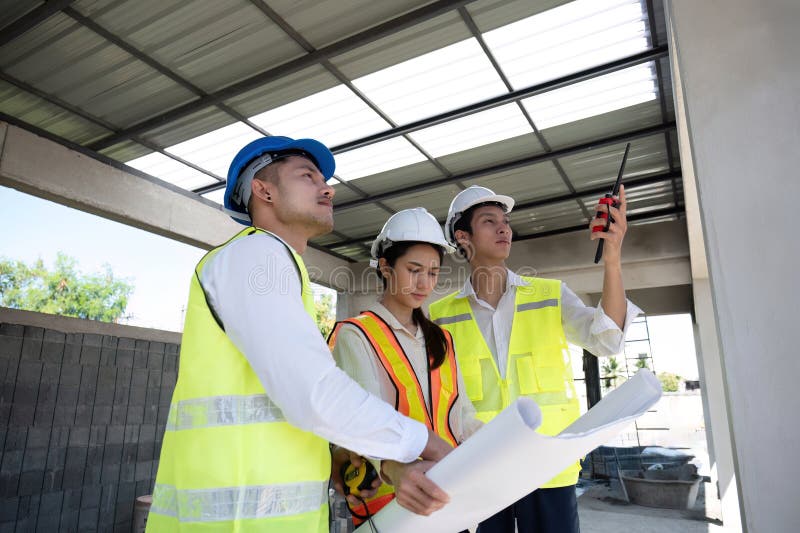 Team of Professional Civil Engineers and Architects Holding Project ...