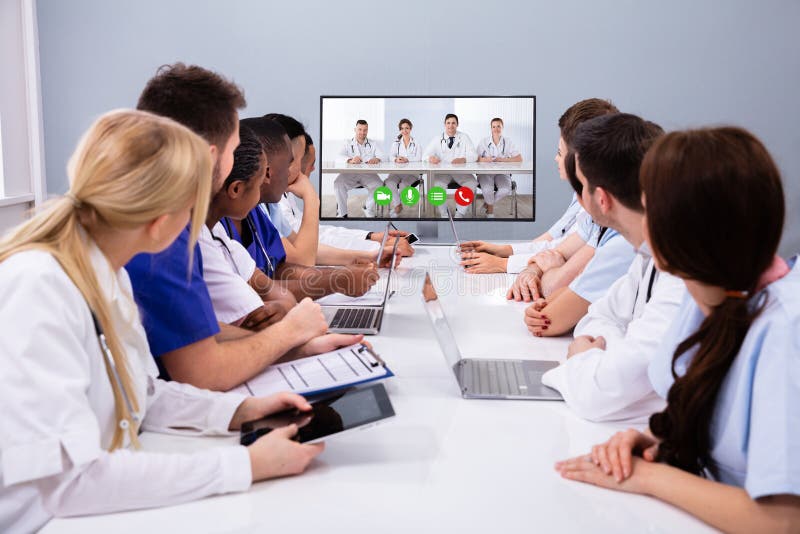 Doctors Having Video Conference Meeting in Hospital Stock Photo - Image ...