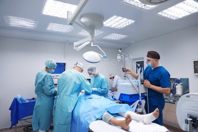 Team of Doctors Performing Operation in Surgery Room Stock Image ...