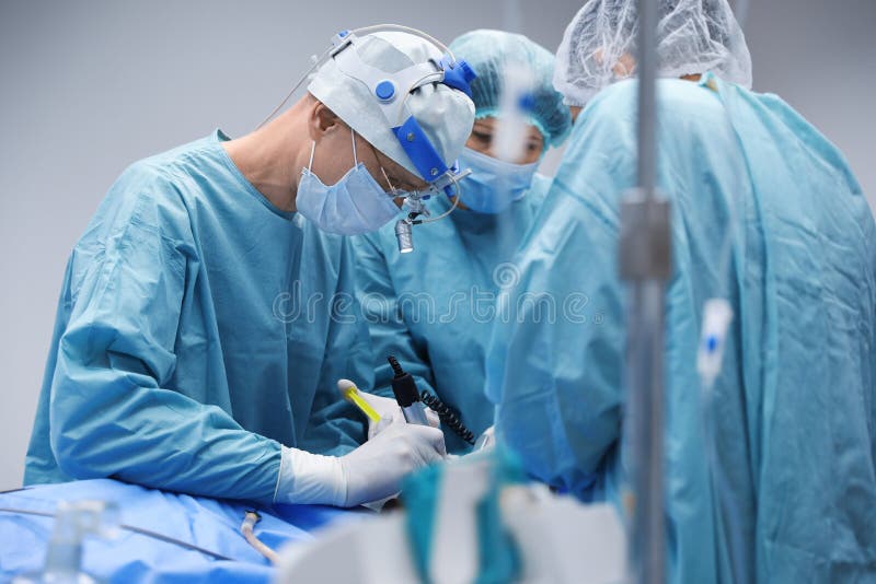 Team of Doctors Performing Operation in Surgery Room Stock Image ...