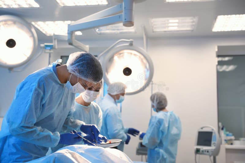 Team of Doctors Performing Operation in Surgery Room Stock Image ...