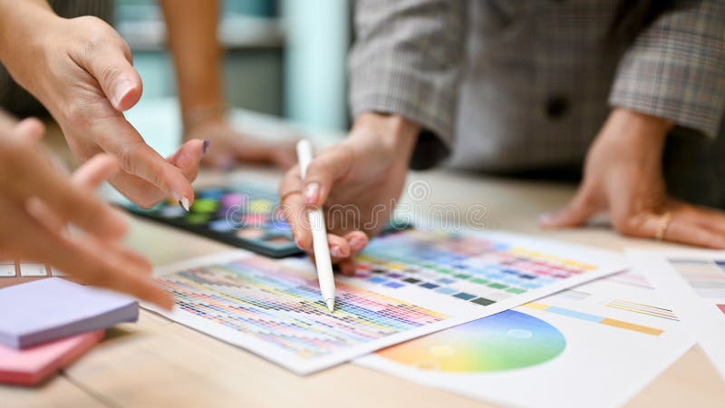 A Team of Professional Graphic Designer Having a Meeting. Cropped Stock ...