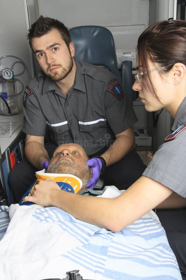 Team of Professional Paramedics Giving Unconscious Stock Image - Image ...