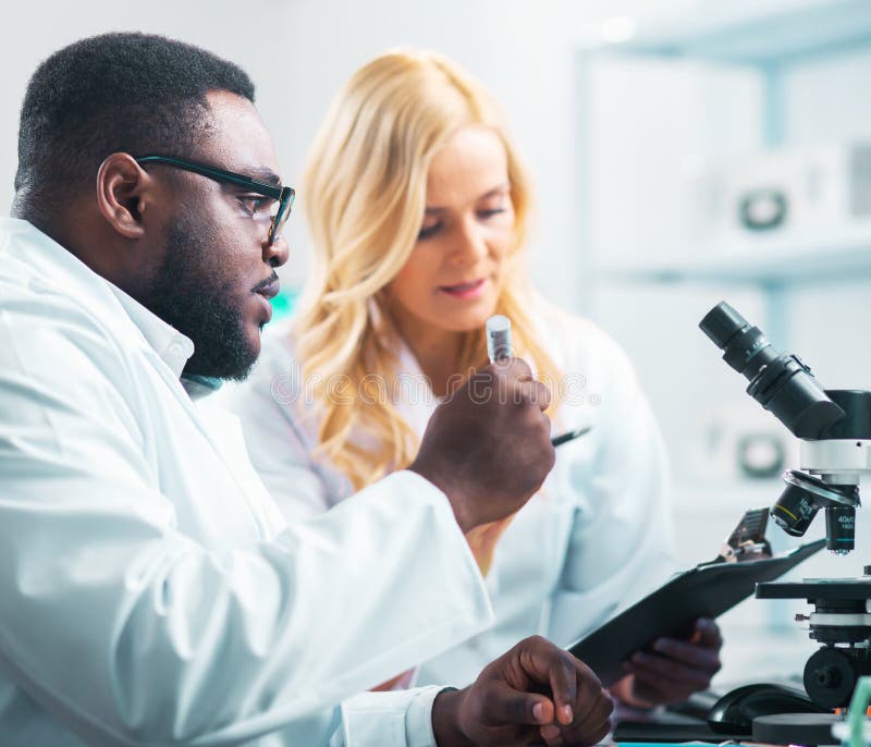 Team of Professional Scientists Working on a Vaccine in a Modern ...