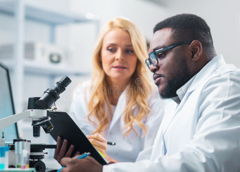 Team of Professional Scientists Working on a Vaccine in a Modern ...