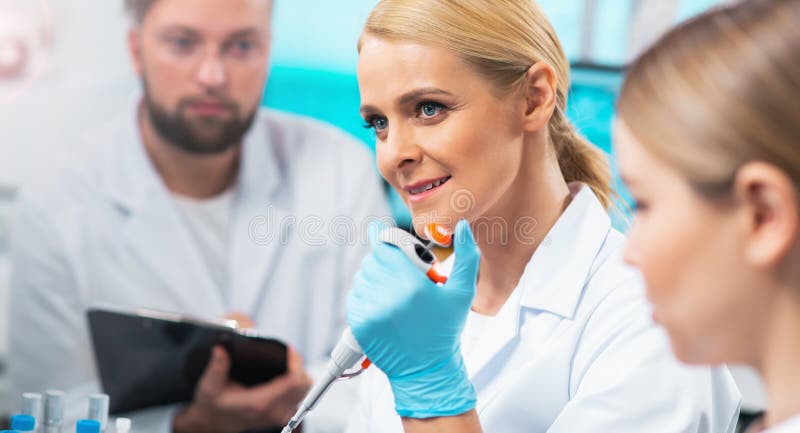 Team of Professional Scientists Working on a Vaccine in a Modern ...