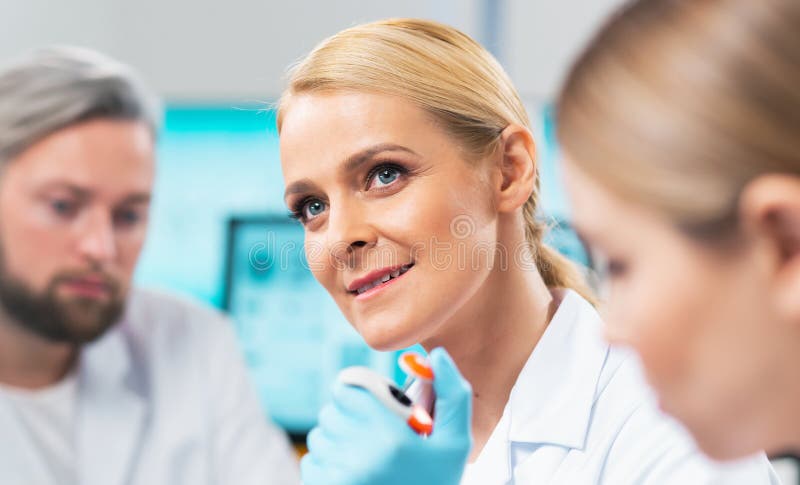 Team of Professional Scientists Working on a Vaccine in a Modern ...