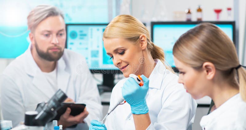 Team of Professional Scientists Working on a Vaccine in a Modern ...