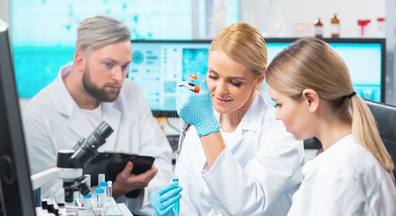 Team of Professional Scientists Working on a Vaccine in a Modern ...