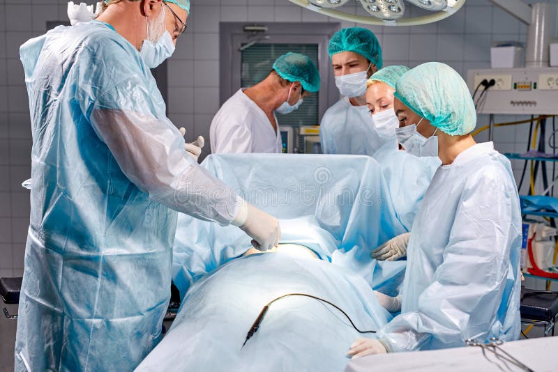 Team of Professional Smart Serious Surgeons Wearing Medical Uniform Had ...