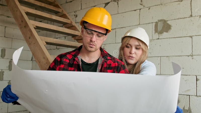 Team of Professionals Analyzing Drawings Inside House Under ...