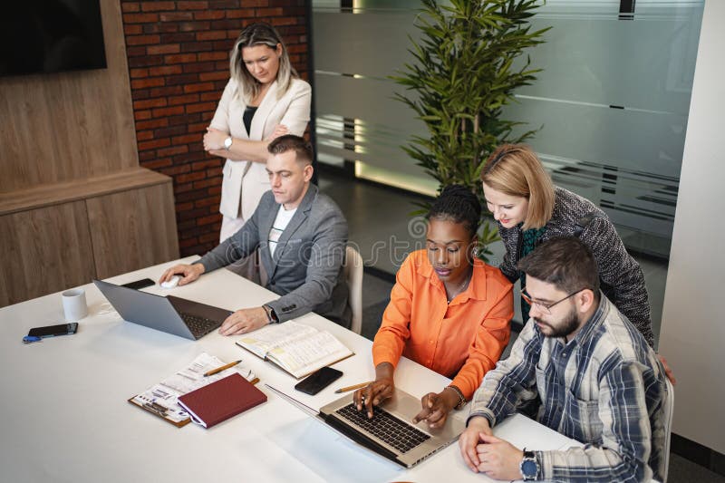 Team of Professionals Collaborating on Laptops Stock Image - Image of ...