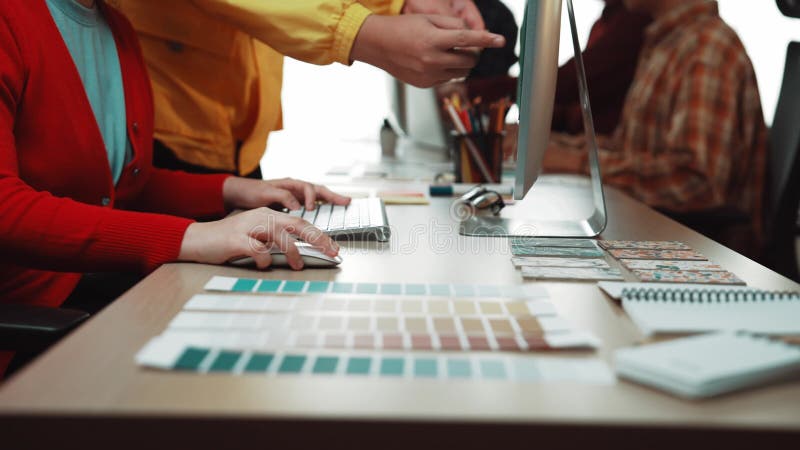 Group of Professionals Collaborating on a Design Project in a Modern ...