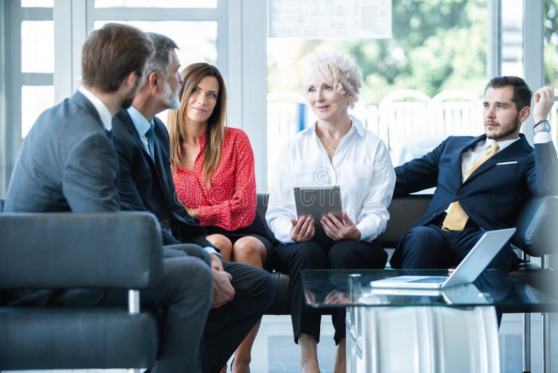 Team of Professionals Having Casual Discussion in Office. Stock Photo ...