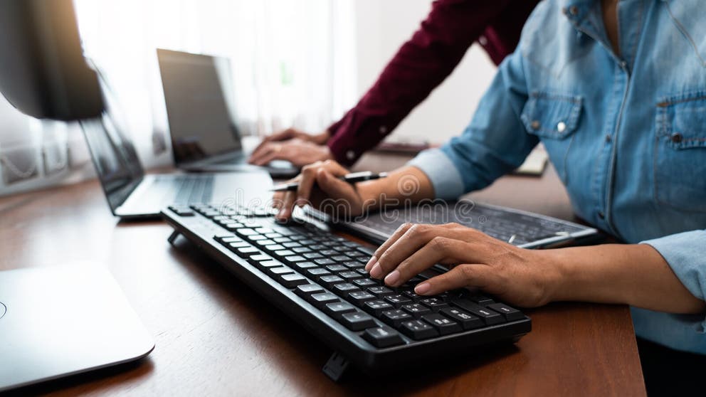 Team of Programmer Working To Find Solution To Problem and Coding Technologies in a Software ...