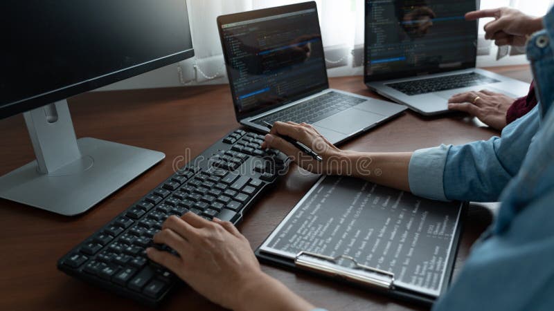 Team of Programmer Working To Find Solution To Problem and Coding ...