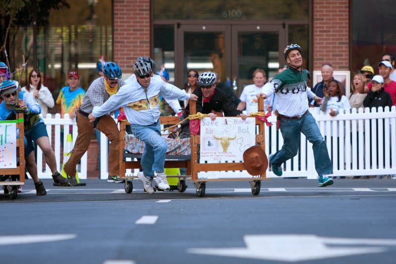 Team Pushes Bed To Finish Line in Mattress Race Editorial Photo - Image ...