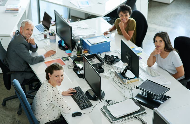 This Team is on the Same Page. Portrait of a Group of Coworkers Sitting ...