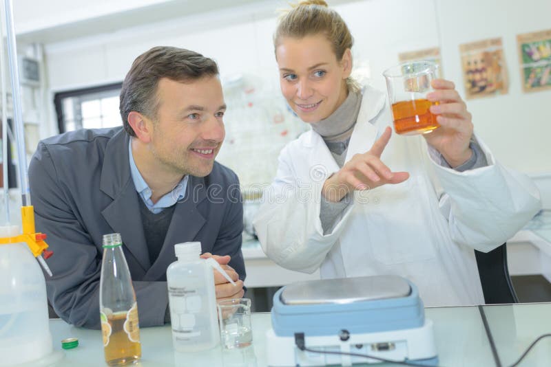 Team Scientists in Laboratory Working on Chemical Testing Stock Photo ...