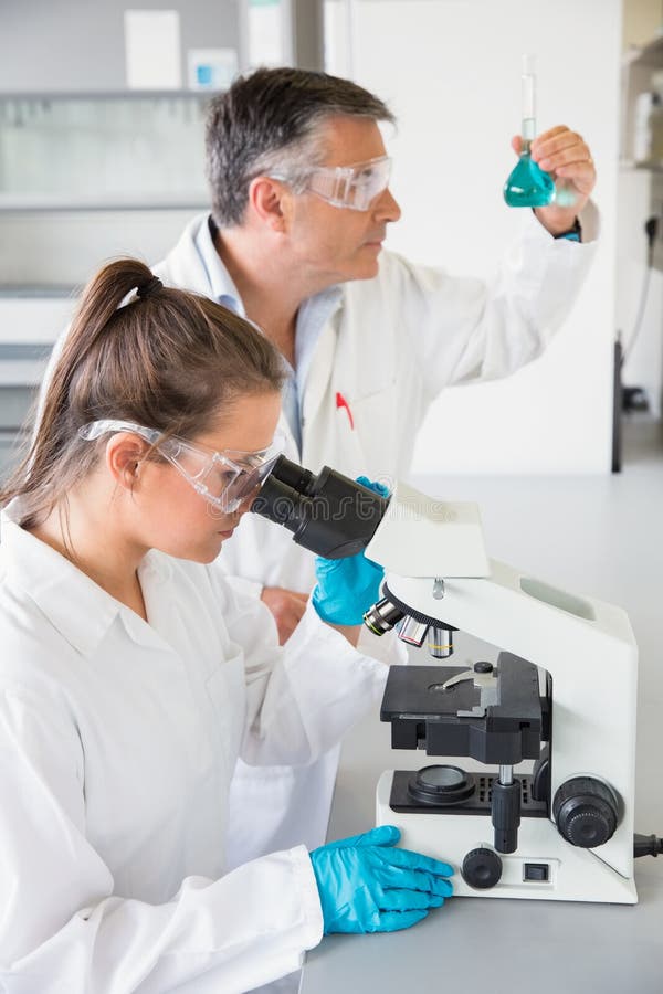 Team of scientists at work stock photo. Image of scientis - 48952478