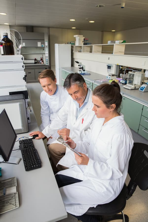Team of Scientists Working Together Stock Photo - Image of experiment ...