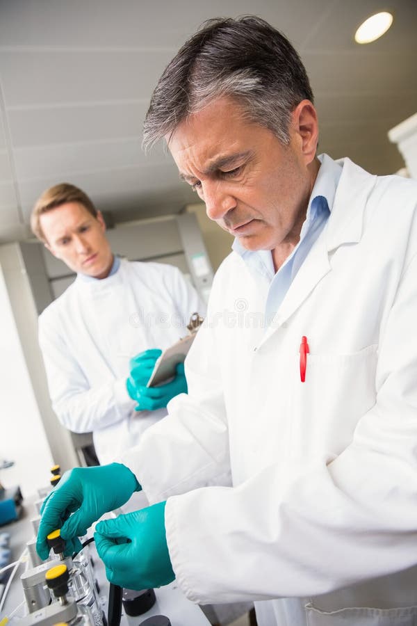Team of Scientists Working Together Stock Image - Image of young ...