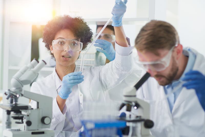 Team of Medical Research Scientists Working on Generation Experimental ...