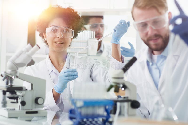 Team of Medical Research Scientists Working on Generation Experimental ...