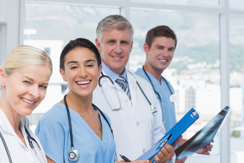 Smiling Doctors and Surgeon Taking Notes Stock Photo - Image of clinic ...