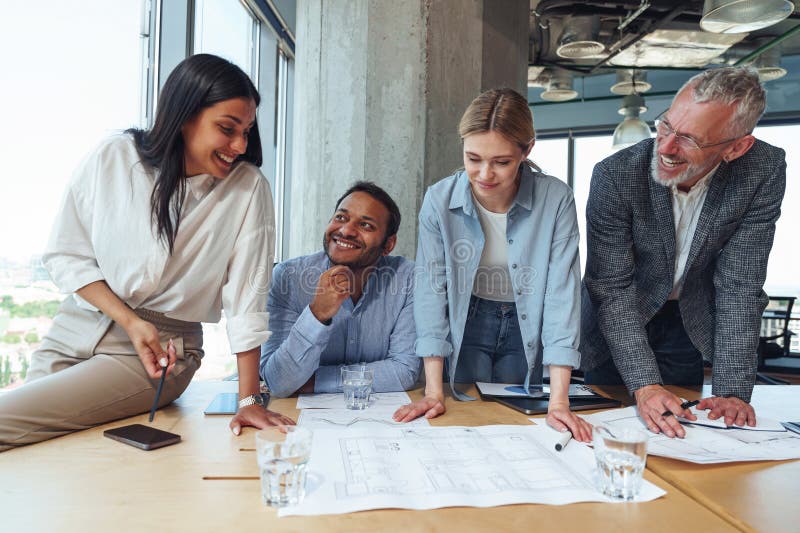 Team of Smiling Professional Design Engineers Working with Project ...