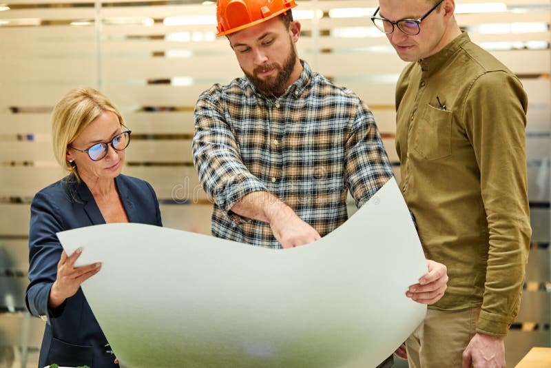 Team Of Structural Engineering Designers Are Working On The Blueprints ...