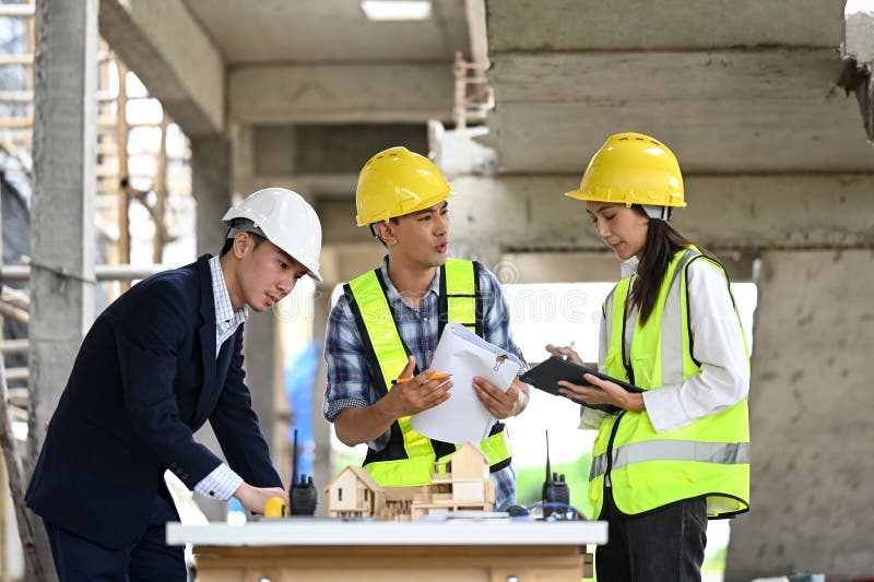 Team of Structural Engineers and Businessman Planning Development ...