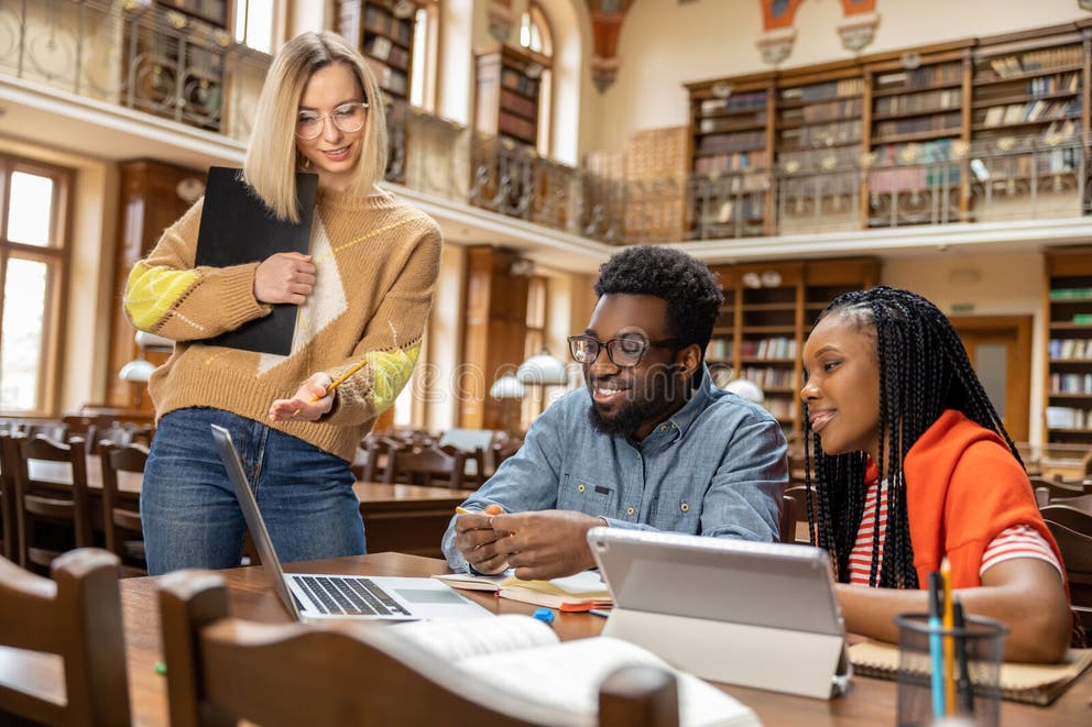 Team of Students Looking Involved and Interested while Working in the ...