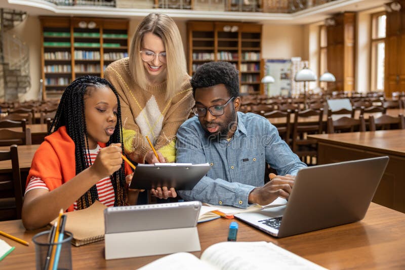 Team of Students Looking Involved and Interested while Working in the ...