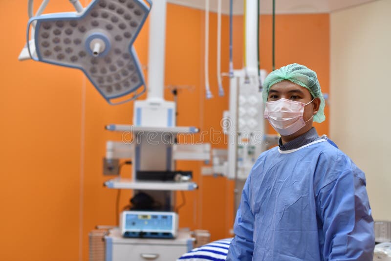 Team Surgeon at Work in Operating Room. Surgical Light in the Operating ...