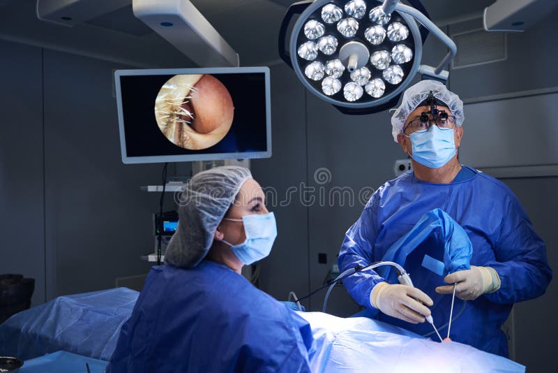 Team of Surgeons Coordinating in Operating Room Stock Image - Image of ...
