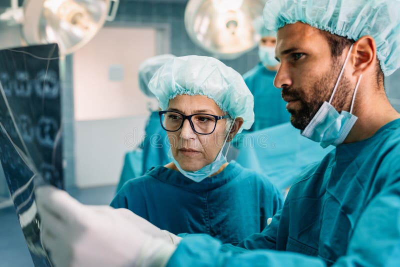 Team of Surgeons in the Operating Room Preparing for Surgery Stock ...