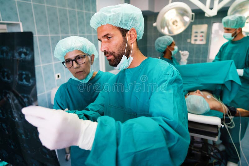 Team of Surgeons in the Operating Room Preparing for Surgery Stock ...