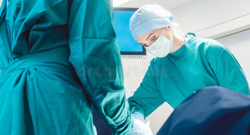 Team Of Surgeons Showing Thumbs Up Stock Photo - Image of health ...