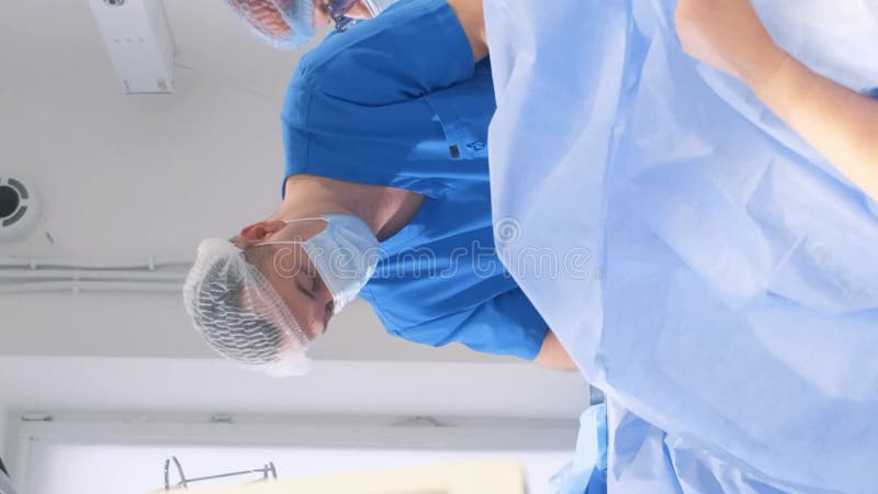 A Team of Surgeons during an Operation To Remove Leg Veins Using ...