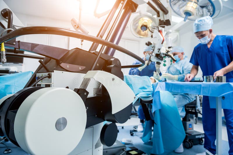A Team of Surgeons Performing Brain Surgery To Remove a Tumor. Stock ...