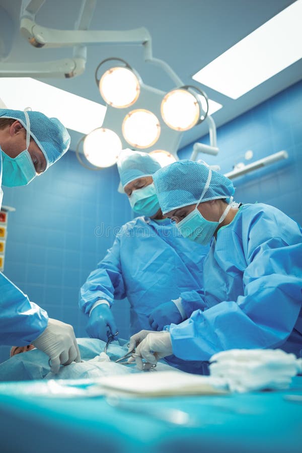 Team of Surgeons Performing Operation in Operation Theater Stock Photo ...