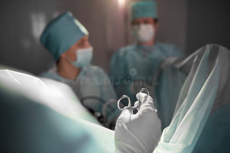 Team of Surgeons Performing Operation Stock Image - Image of ...