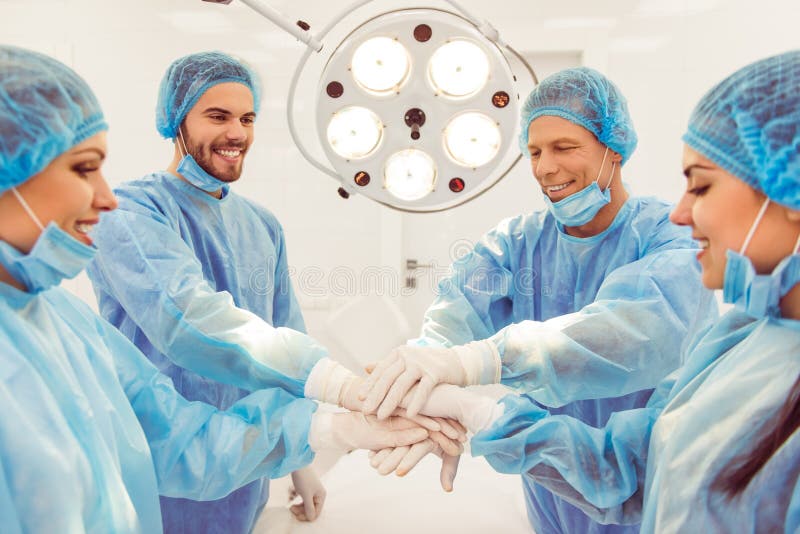 Team surgeons at work stock image. Image of lifestyle - 69371869