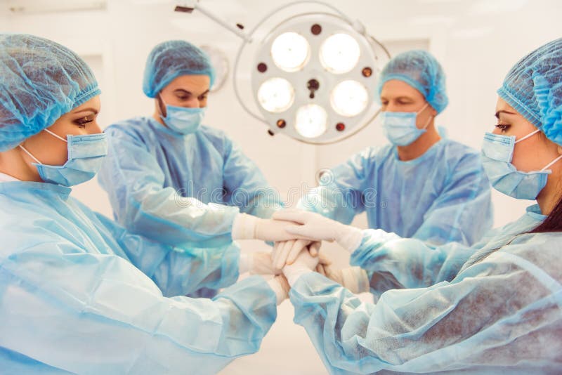 Team surgeons at work stock image. Image of belief, coat - 69371825