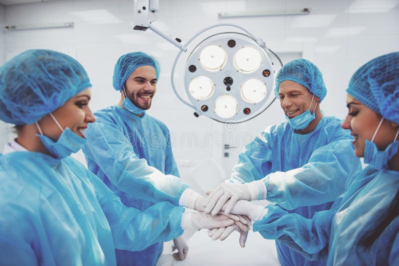 Team surgeons at work stock photo. Image of looking - 241521024