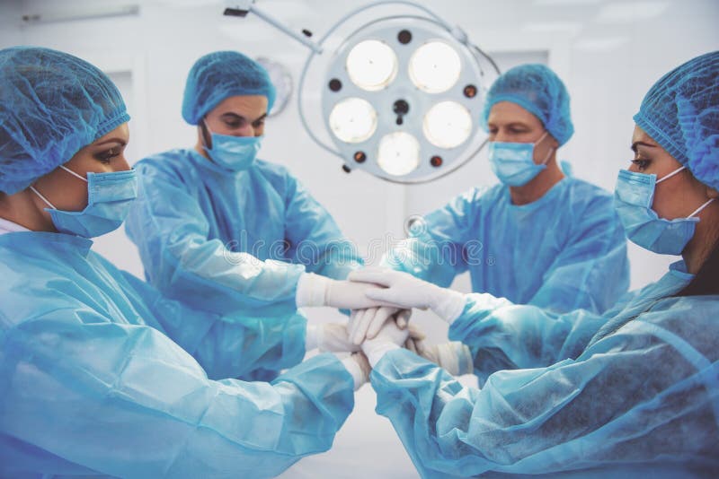 Team surgeons at work stock image. Image of collaborative - 241521021