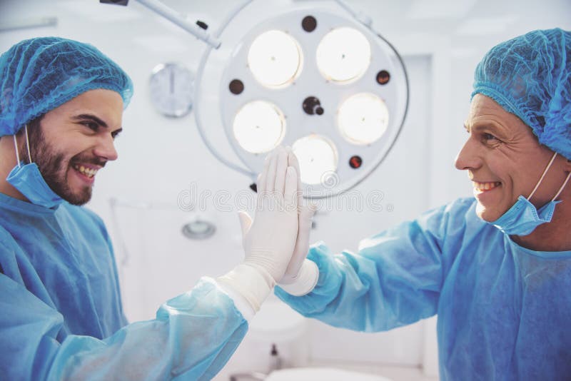 Team surgeons at work stock image. Image of illness - 241521015